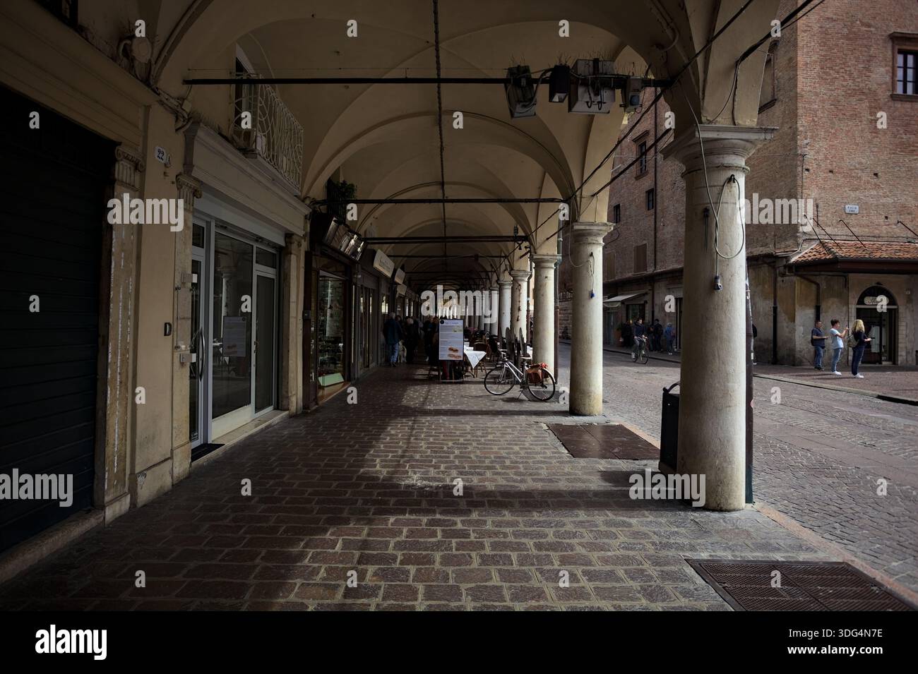 Mantova, Italy - 22ND APRIL 2025 - Porch partially in the shade with ...