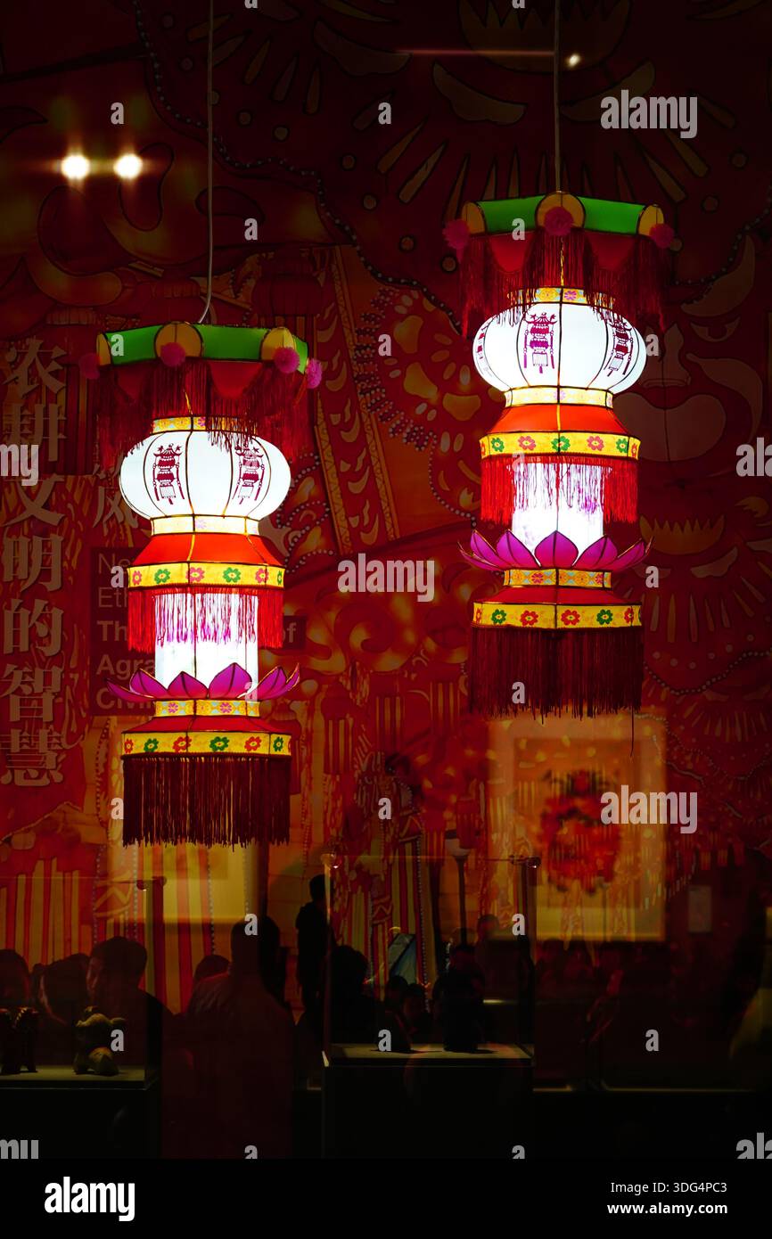 Visitors view exhibits at a folk crafts exhibition at National Art ...