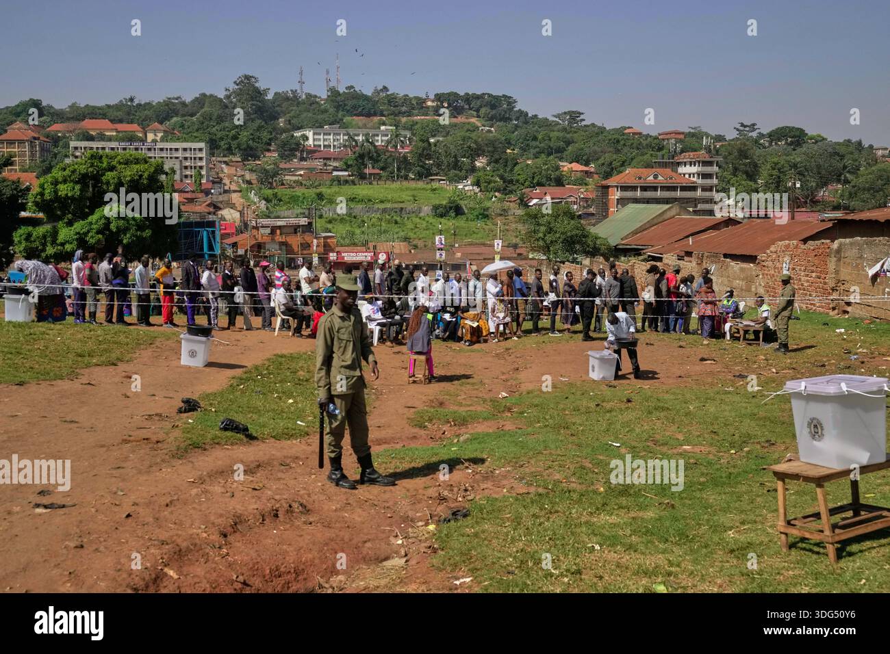 Voters line up to cast their ballots at a polling station, during the ...