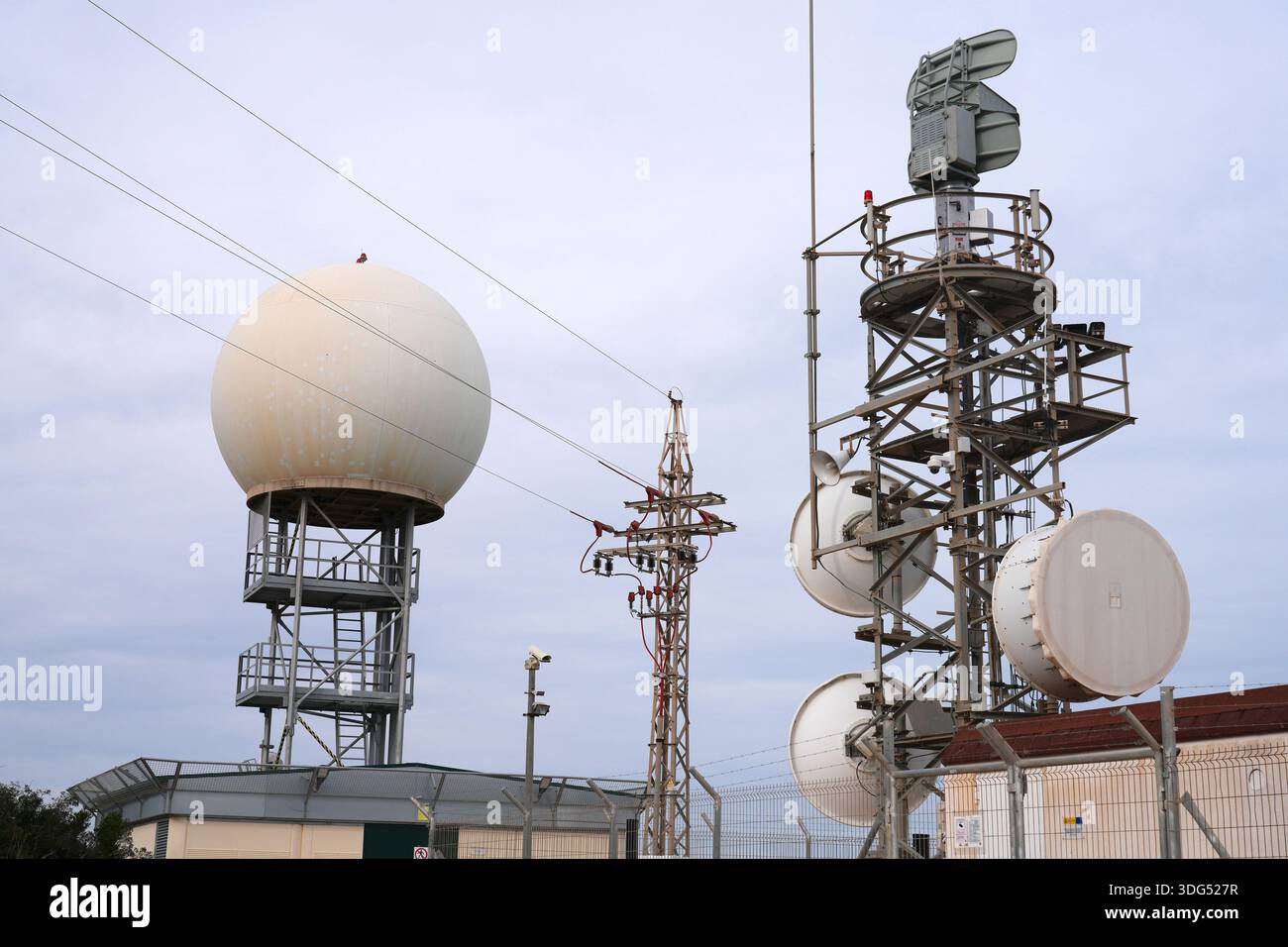 Scientific weather station with meteorological radar on a mountain top ...