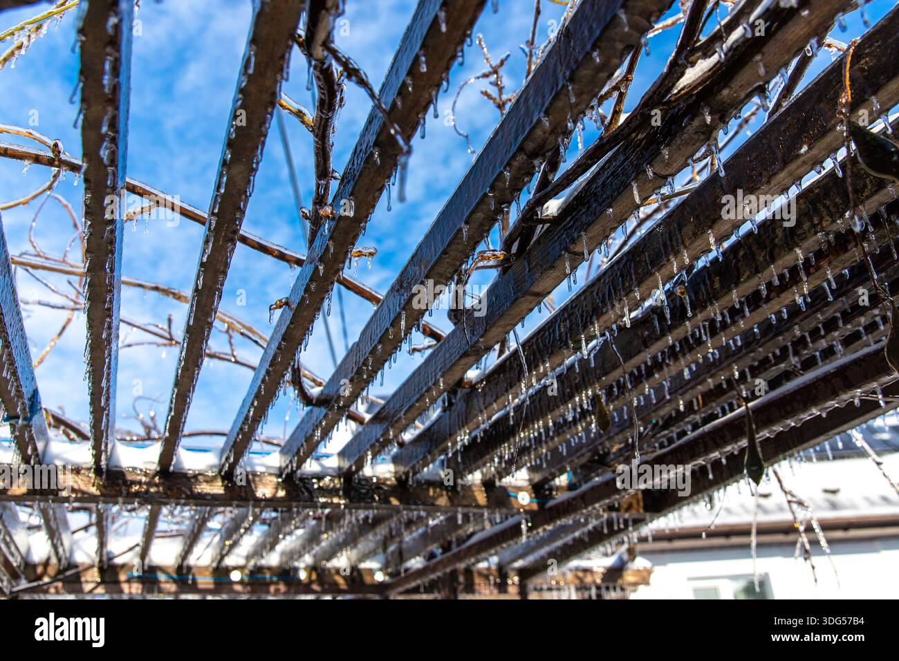 Icicles hang on the roof in winter. Selective focus. nature Stock Photo ...