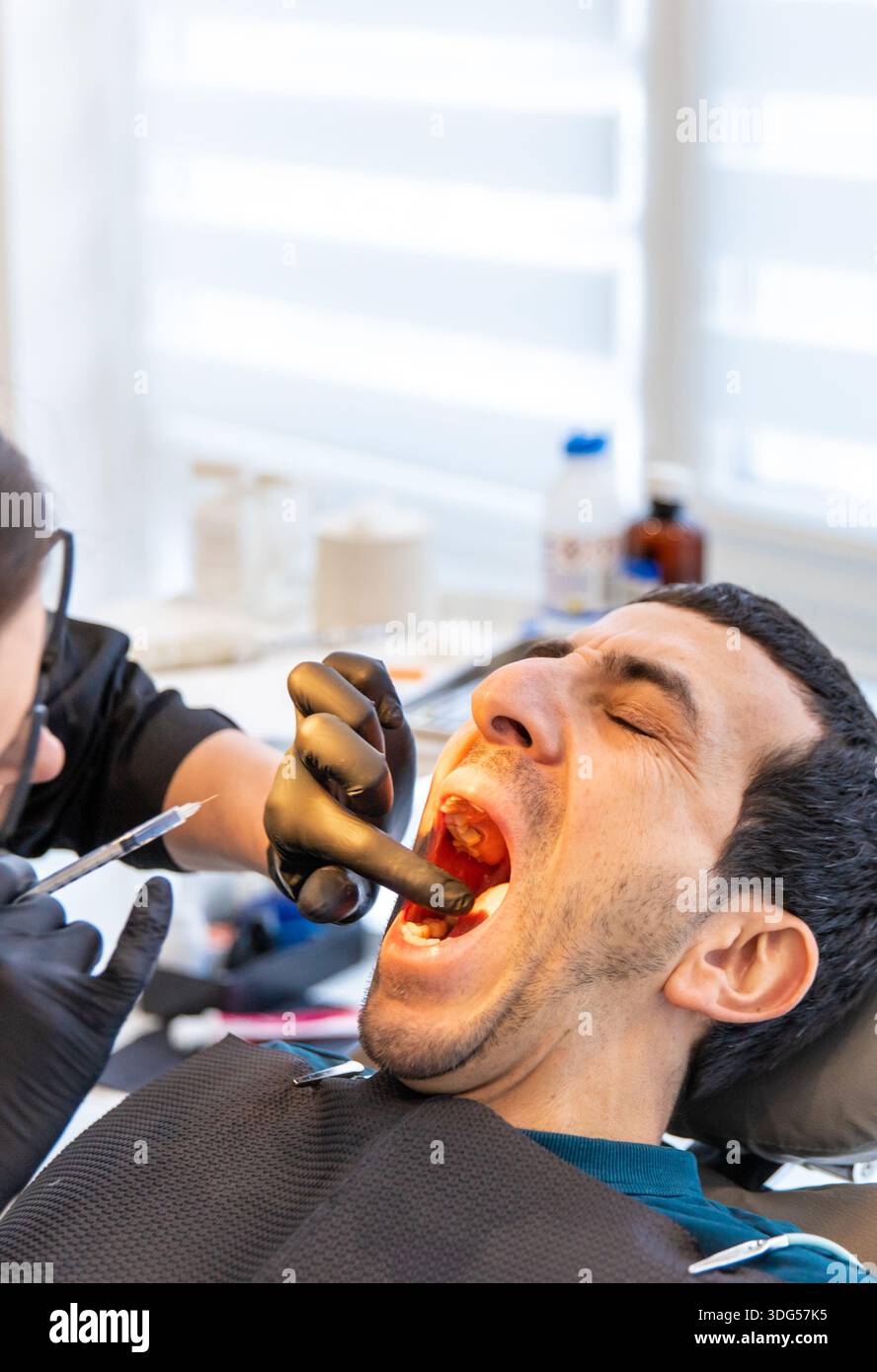 A man at a dentist appointment. Selective focus. people Stock Photo - Alamy