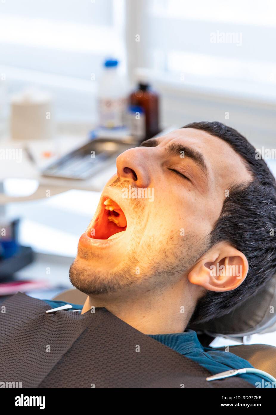 A man at a dentist appointment. Selective focus. people Stock Photo - Alamy