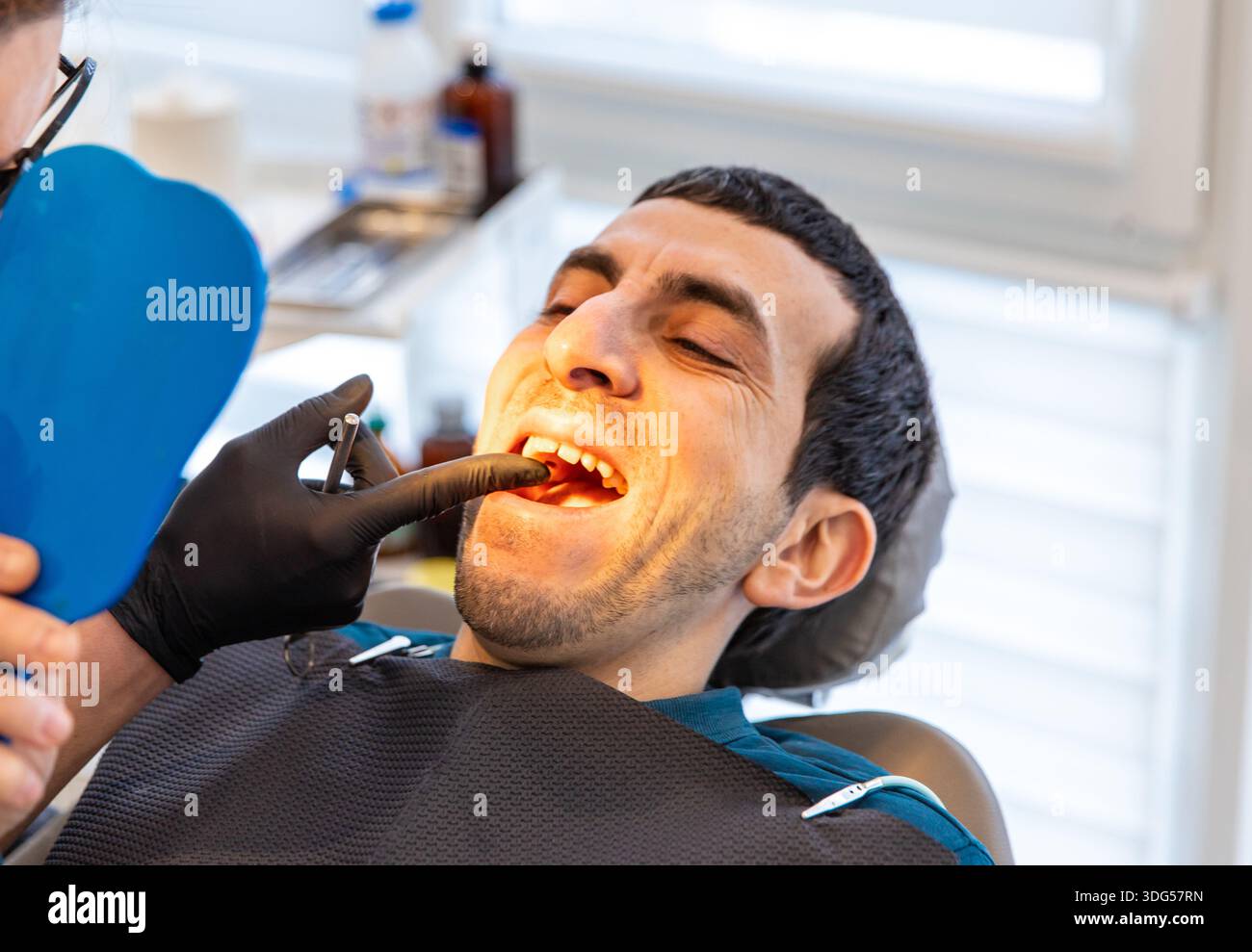 A man at a dentist appointment. Selective focus. people Stock Photo - Alamy