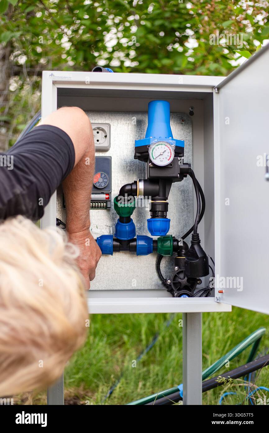 A technician performs maintenance and adjustments to the internal ...