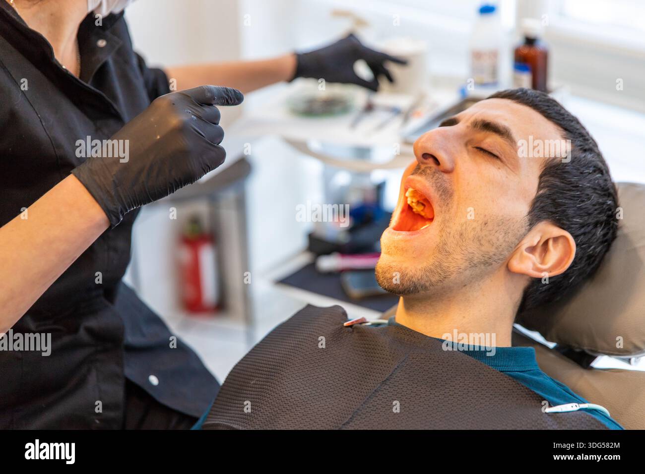 A man at a dentist appointment. Selective focus. people Stock Photo - Alamy