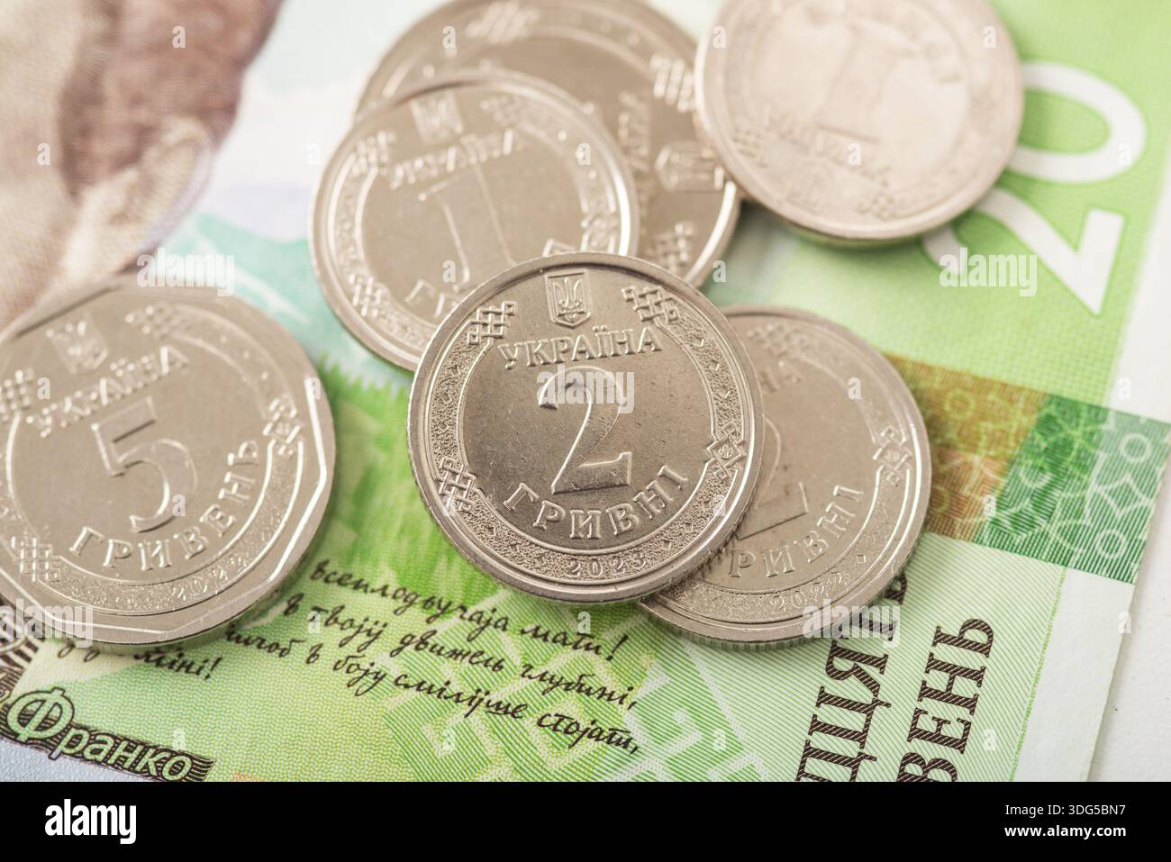 Close-up of Ukrainian hryvnia coins on banknotes, representing national ...