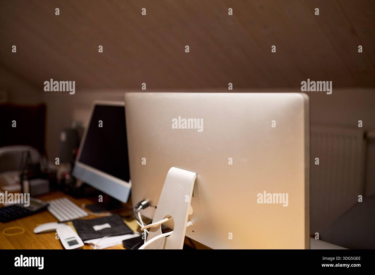 Two computer monitors set up on a desk in a modern office environment ...