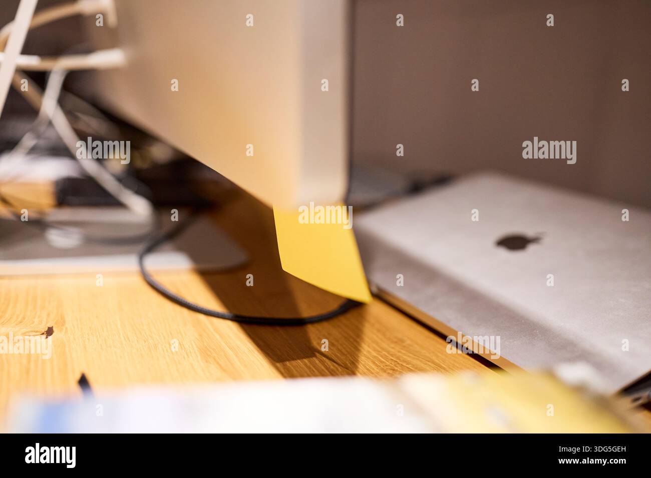 Close-up of a yellow sticky note attached to a computer monitor ...