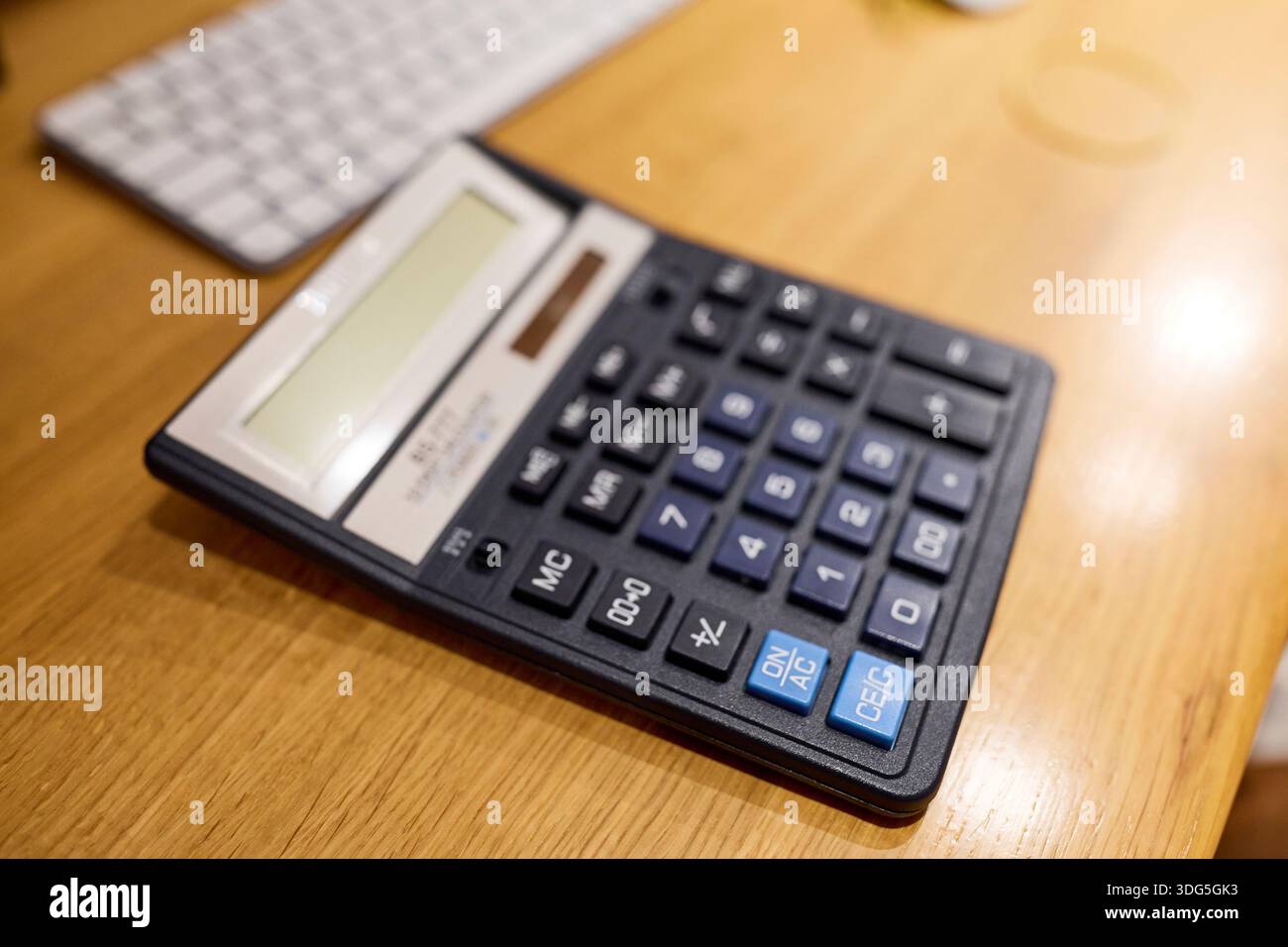 Close-up of a calculator placed on a desk, representing office work ...