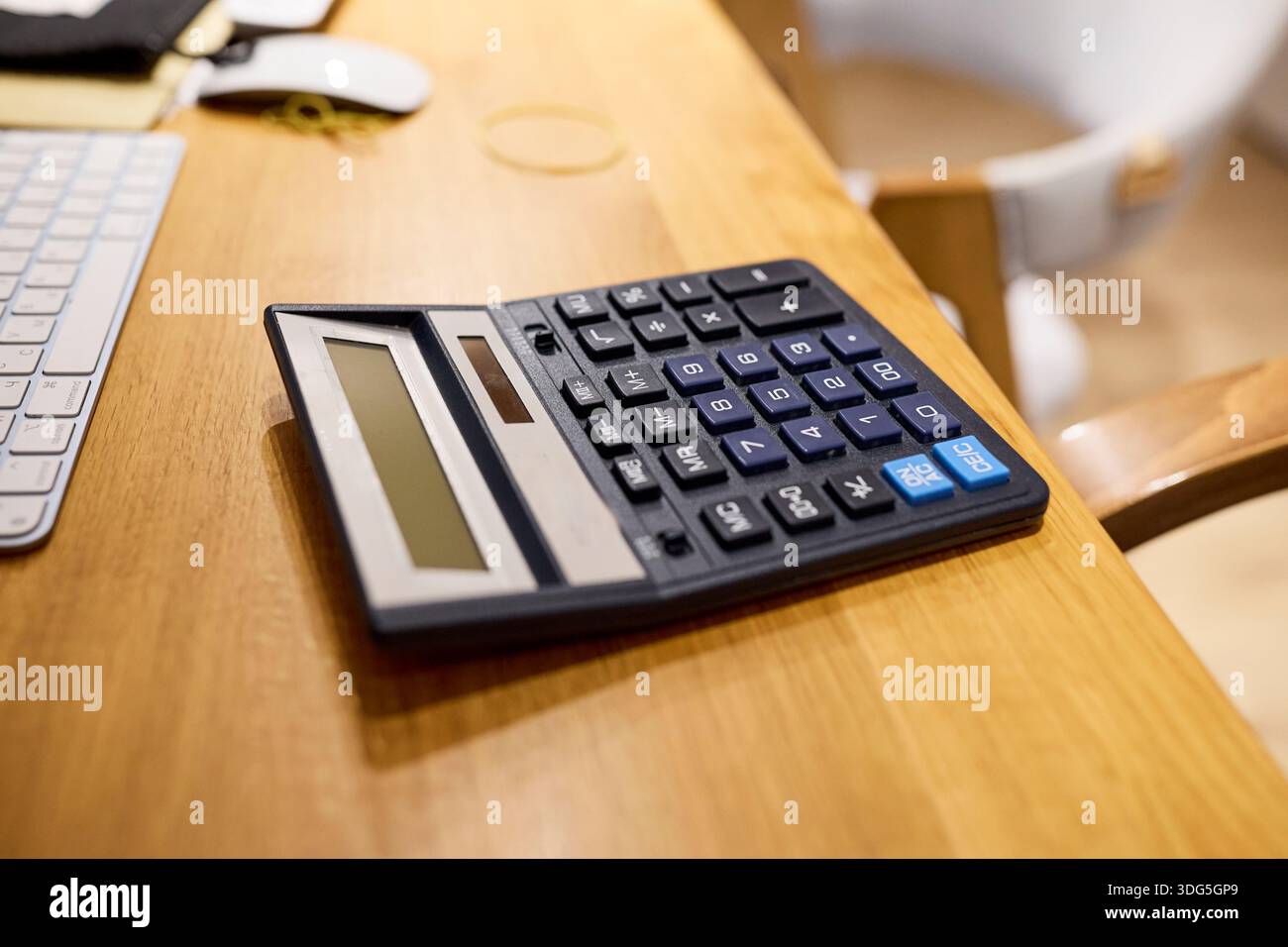 Close-up of a calculator placed on a desk, representing office work ...