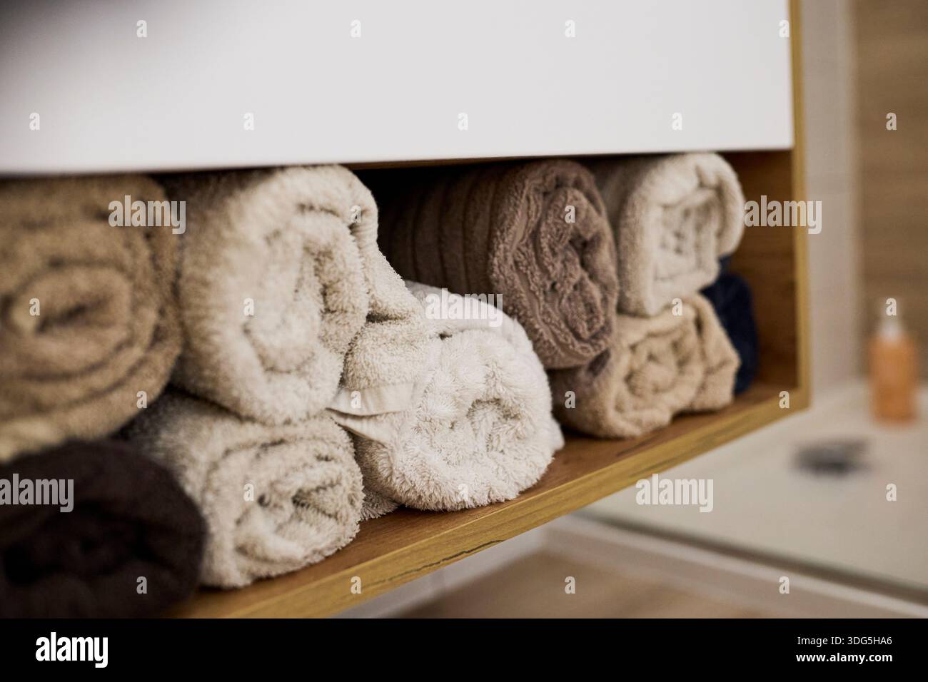 Rolled Towels in a Bathroom Interior Stock Photo - Alamy
