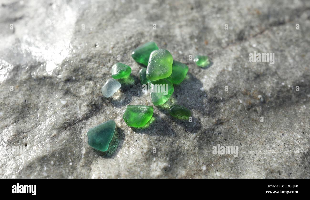 Glass sea pebbles of different colours on shore, beach. Nature and ...
