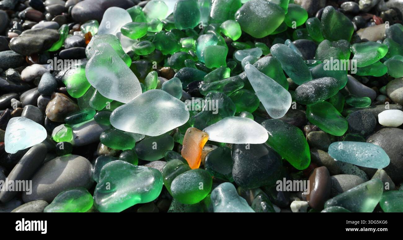 Glass sea pebbles of different colours on shore, beach. Nature and ...