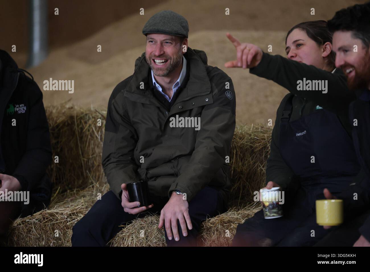 Britain's Prince William reacts as he visits a family run farm in ...