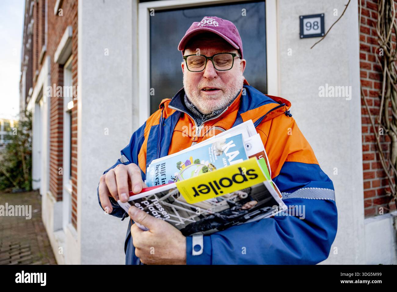 ROTTERDAM - A PostNL mail carrier is delivering letters. ROBIN UTRECHT ...