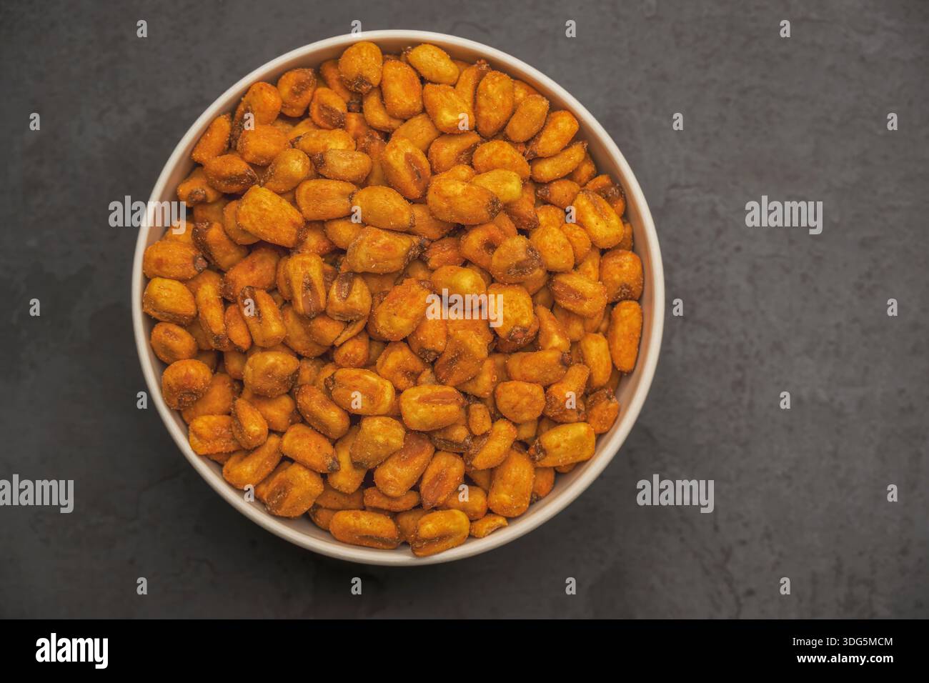 Close up shot of Roasted corn nuts with sauce in bowl, Corn nuts with ...