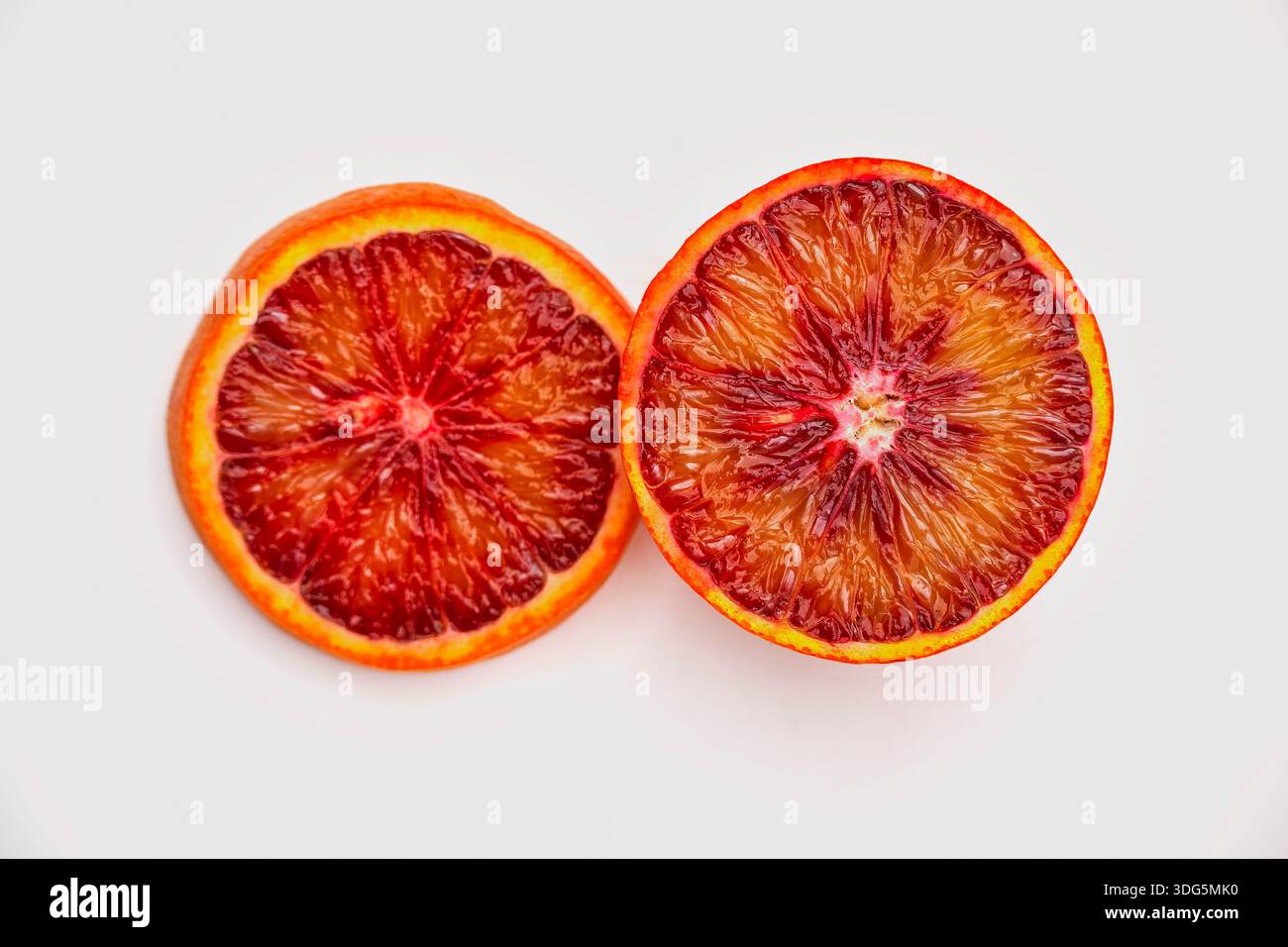 Red blood orange and orange slice, isolated on white background. Close ...