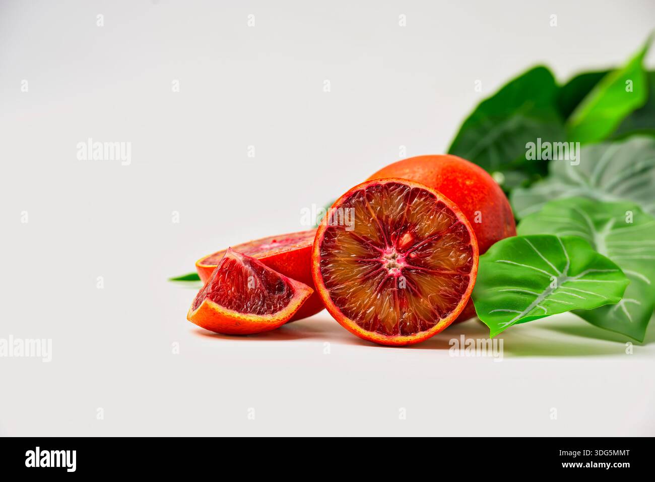 Red blood orange and orange slice, isolated on white background. Close ...
