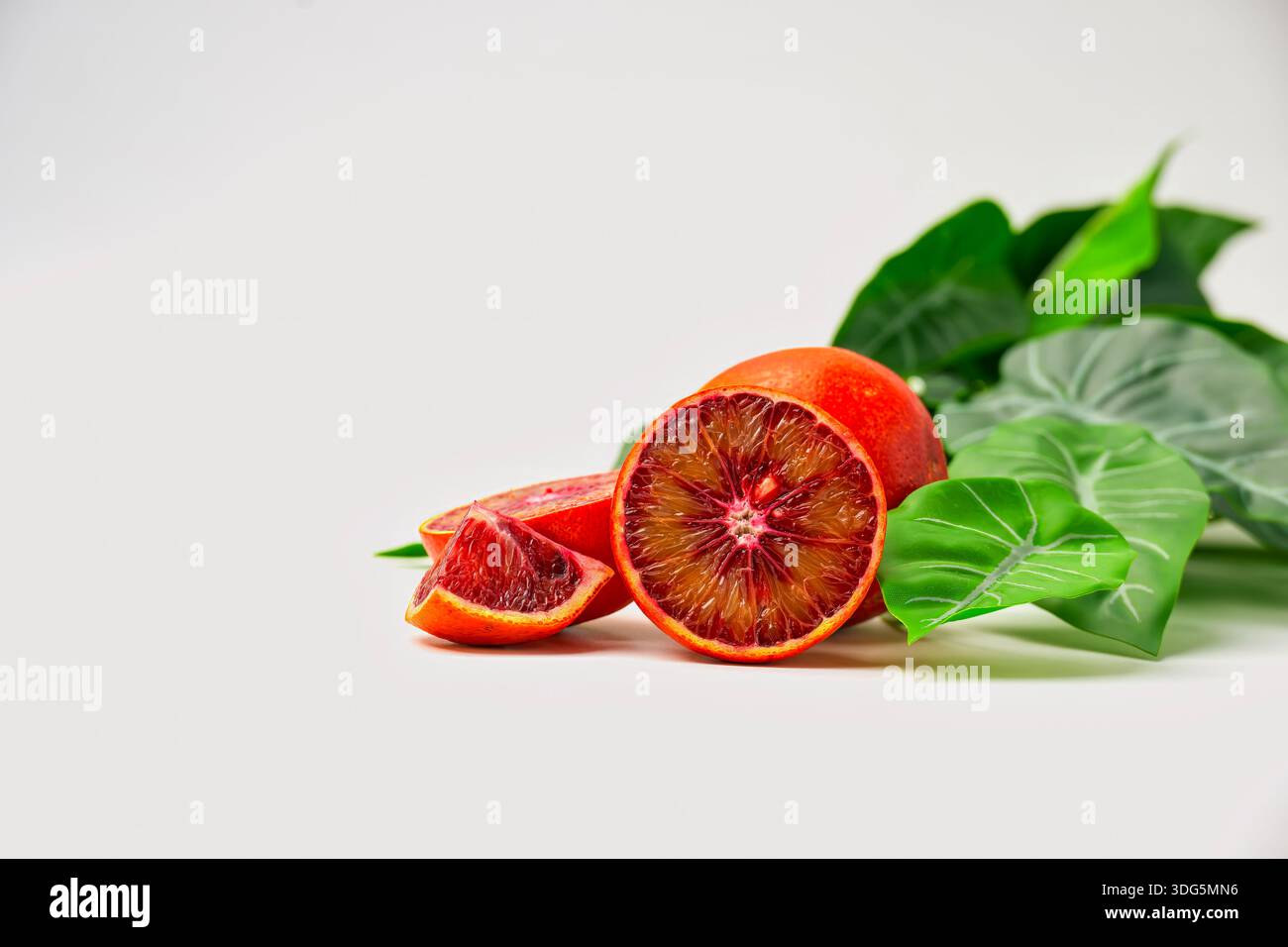 Red blood orange and orange slice, isolated on white background. Close ...