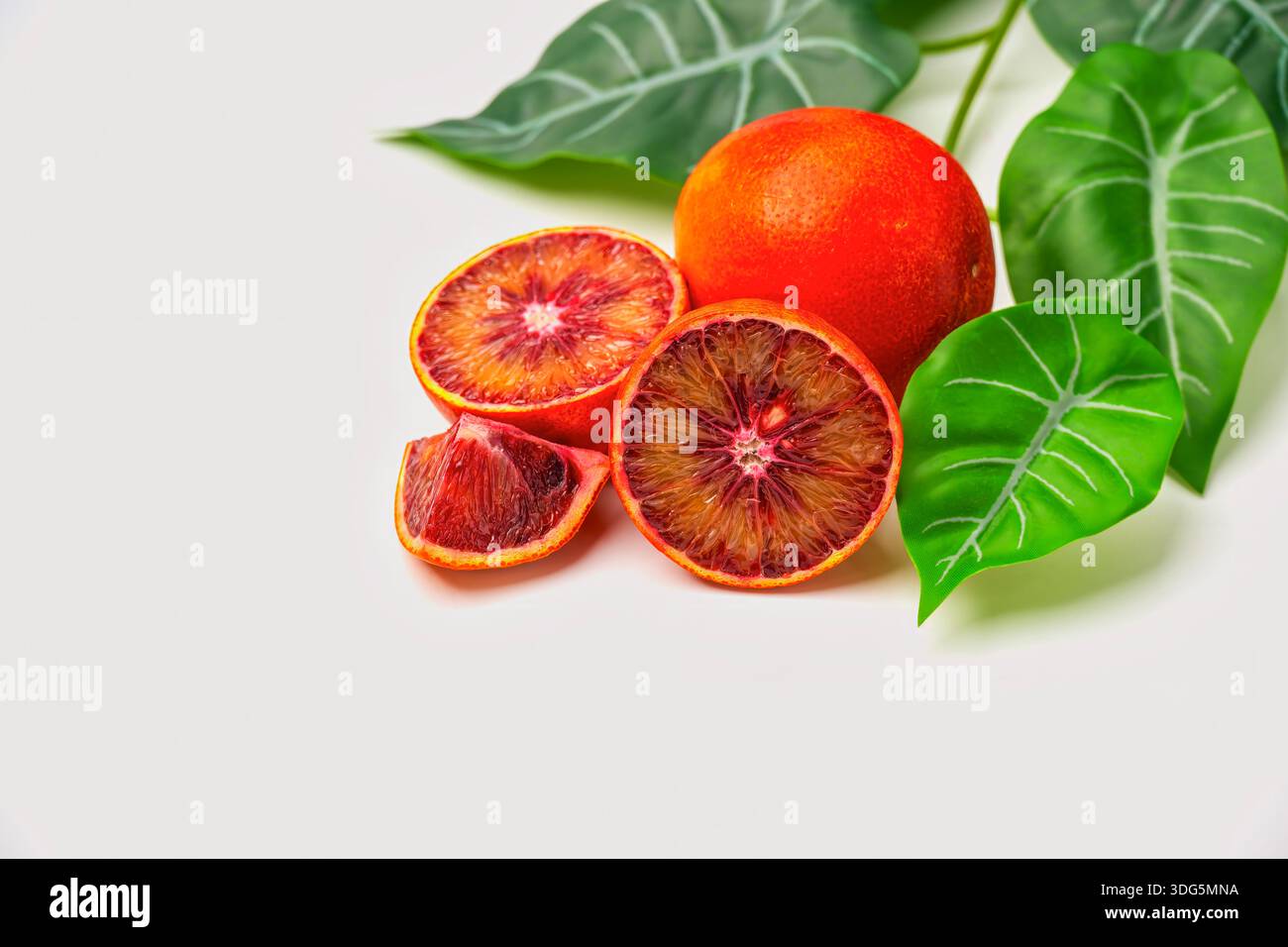 Red blood orange and orange slice, isolated on white background. Close ...