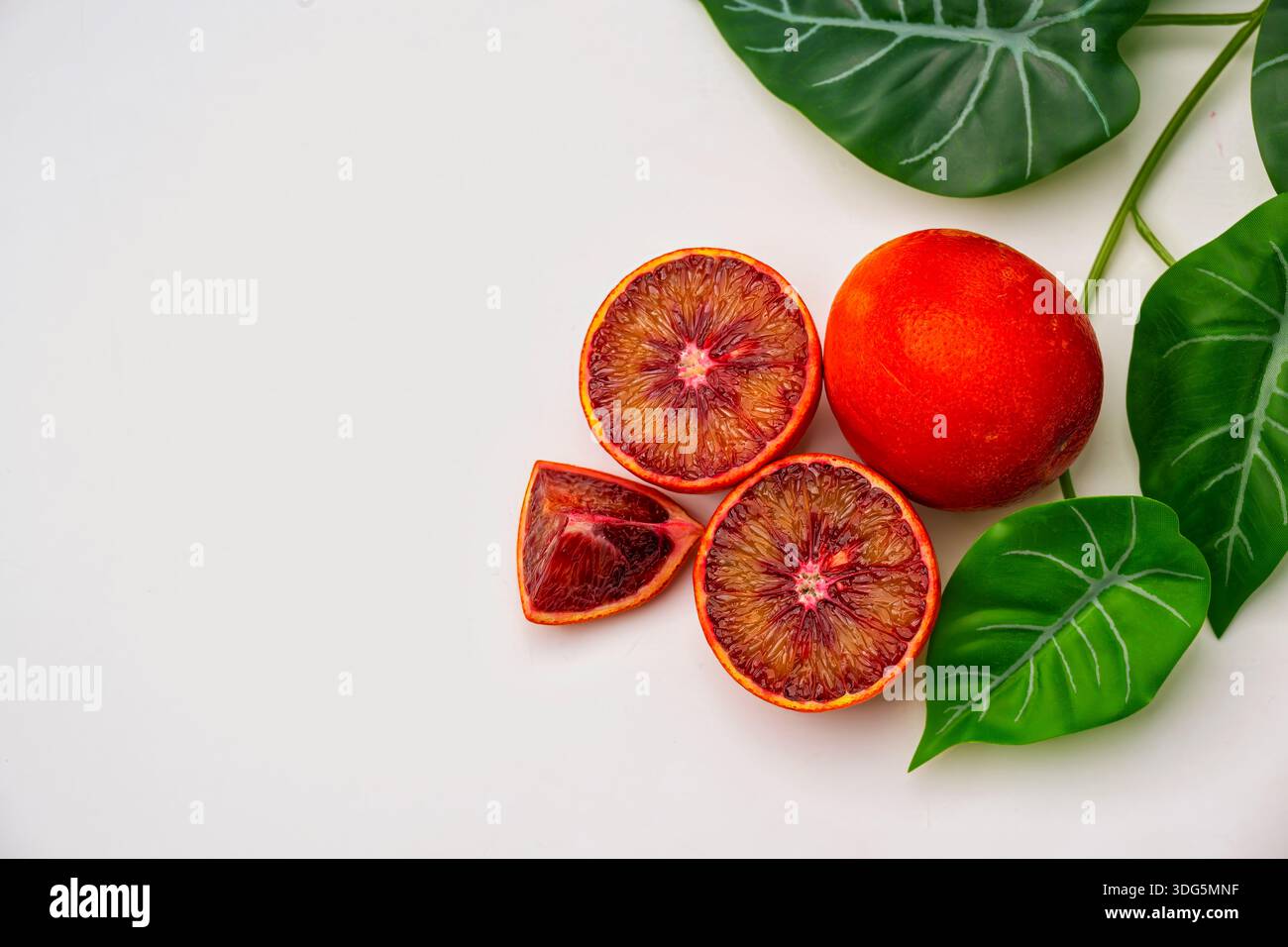 Red blood orange and orange slice, isolated on white background. Close ...