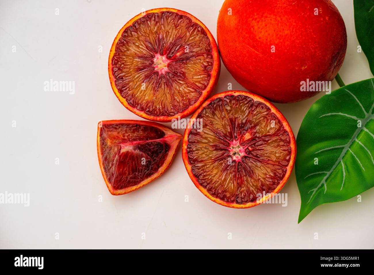 Red blood orange and orange slice, isolated on white background. Close ...