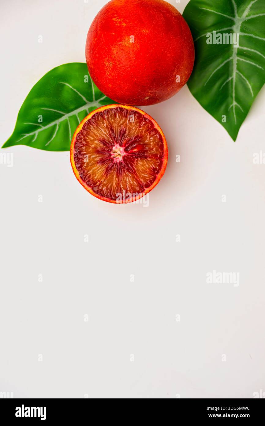 Red blood orange and orange slice, isolated on white background. Close ...