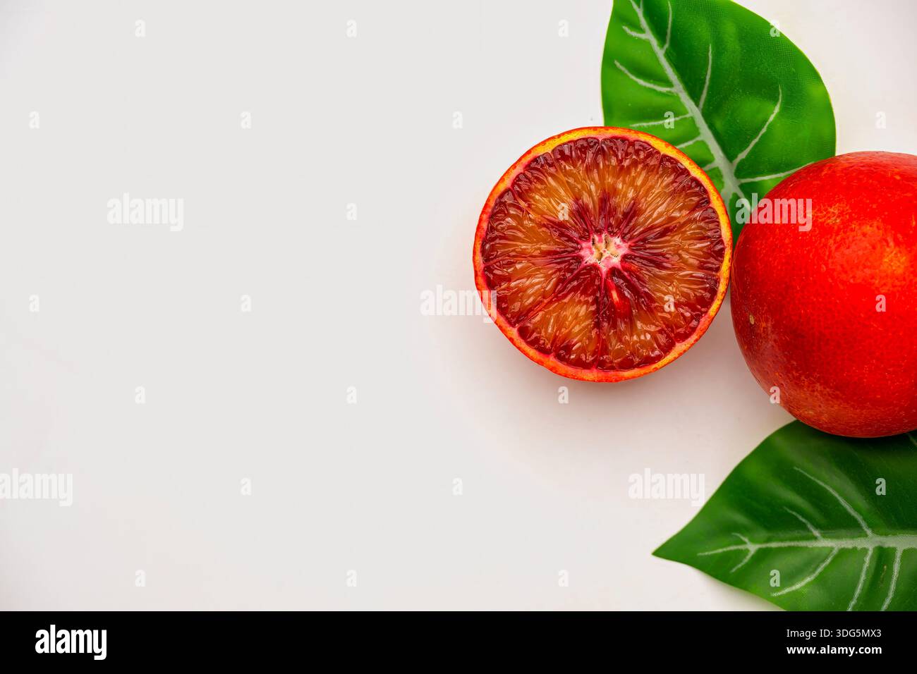 Red blood orange and orange slice, isolated on white background. Close ...
