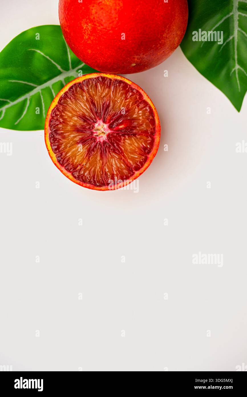 Red blood orange and orange slice, isolated on white background. Close ...