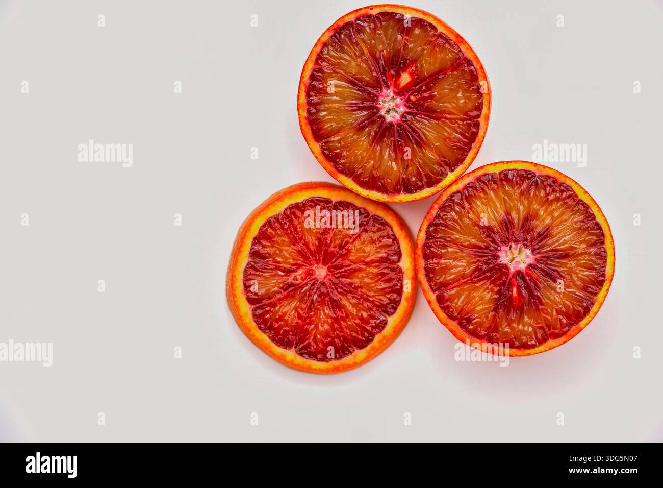 Red blood orange and orange slice, isolated on white background. Close ...