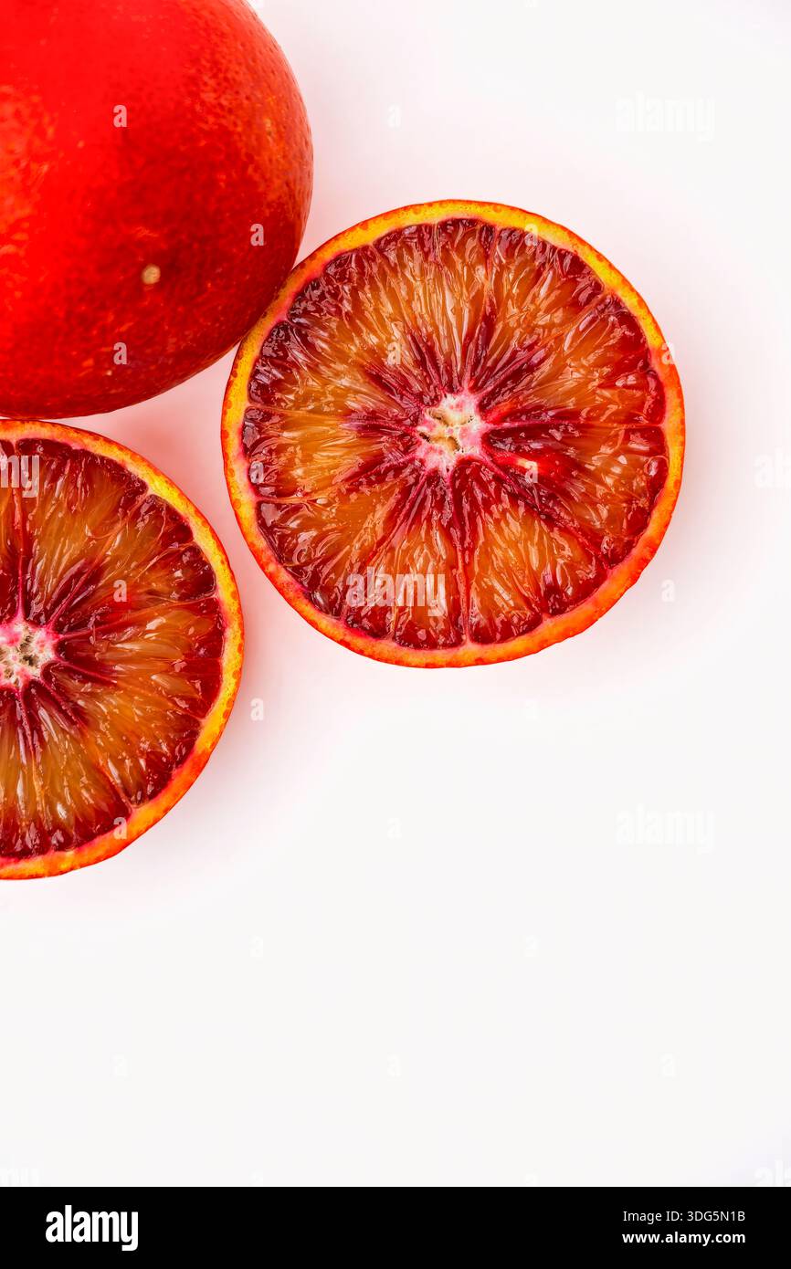 Red blood orange and orange slice, isolated on white background. Close ...