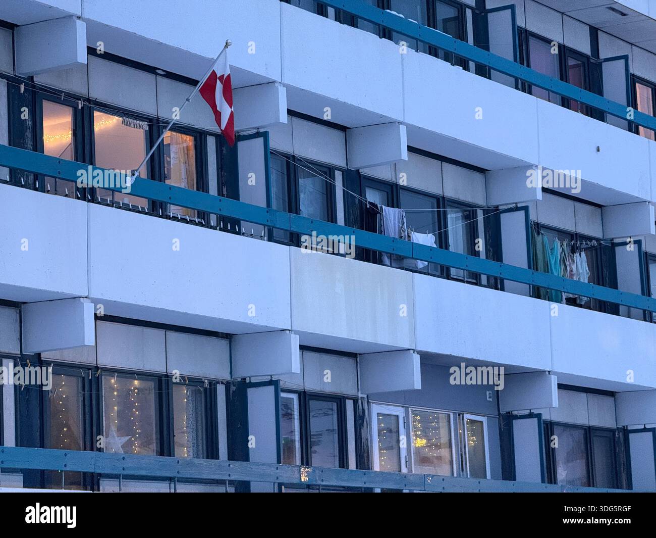14 January 2026, Greenland, Nuuk: The Greenlandic flag on residential ...