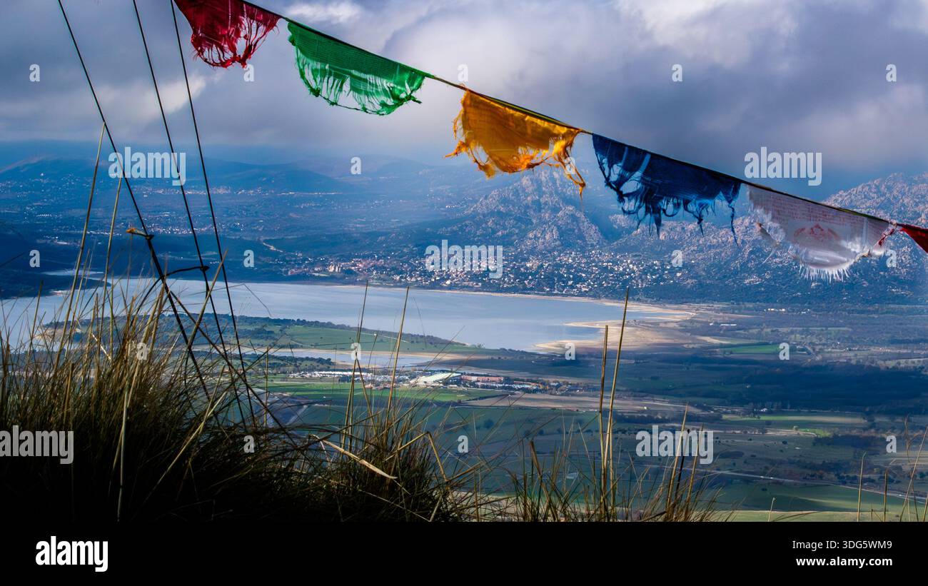 Prayer Flags Waving Over a Scenic Mountain and Reservoir Landscape ...