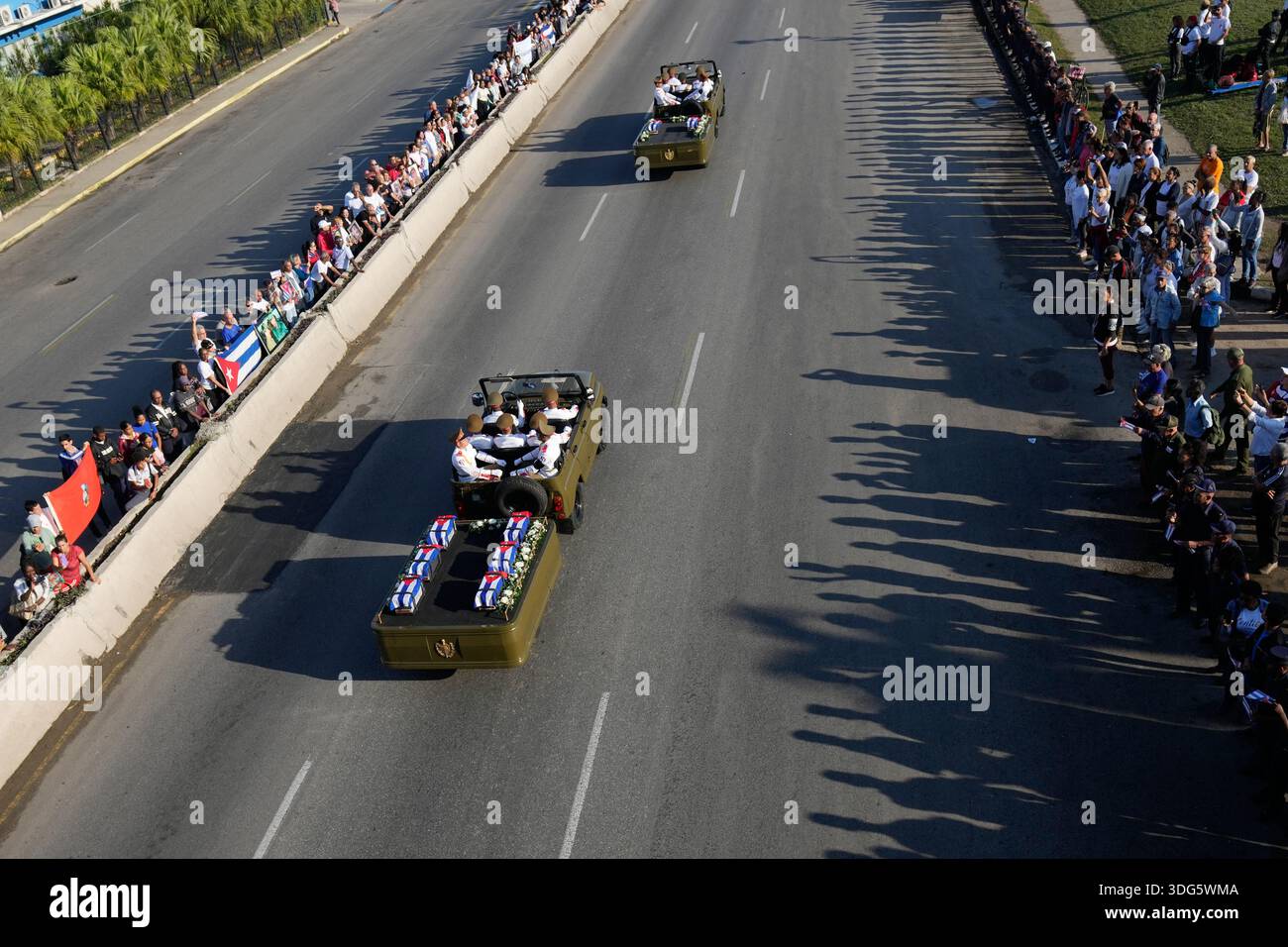A motorcade transports the coffins of Cuban officers killed during the ...