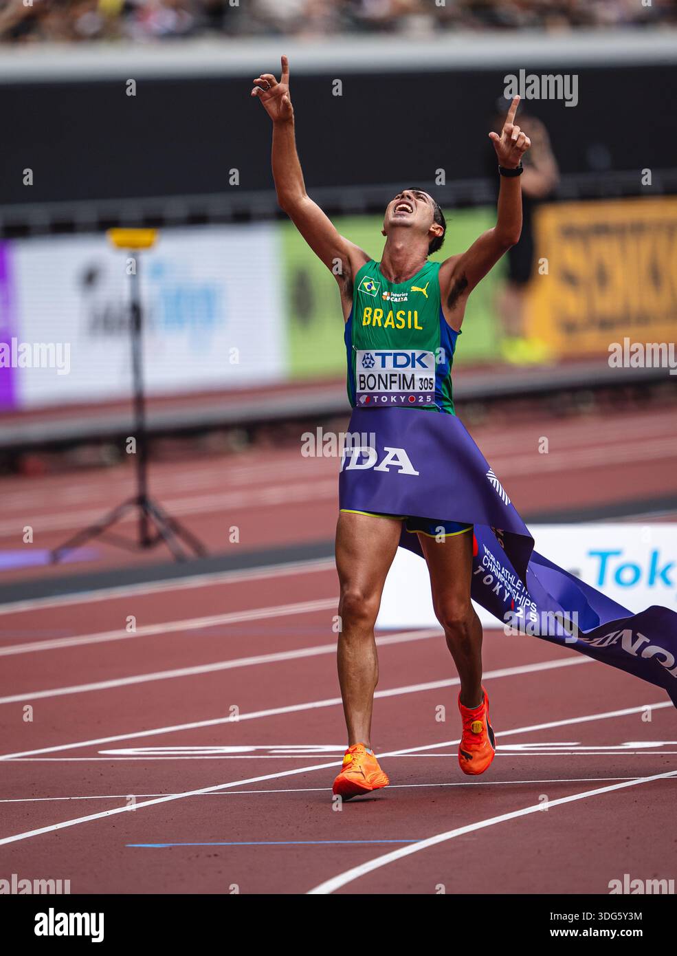 Caio Bonfim celebrating her victory with her country's flag at the 2025 ...
