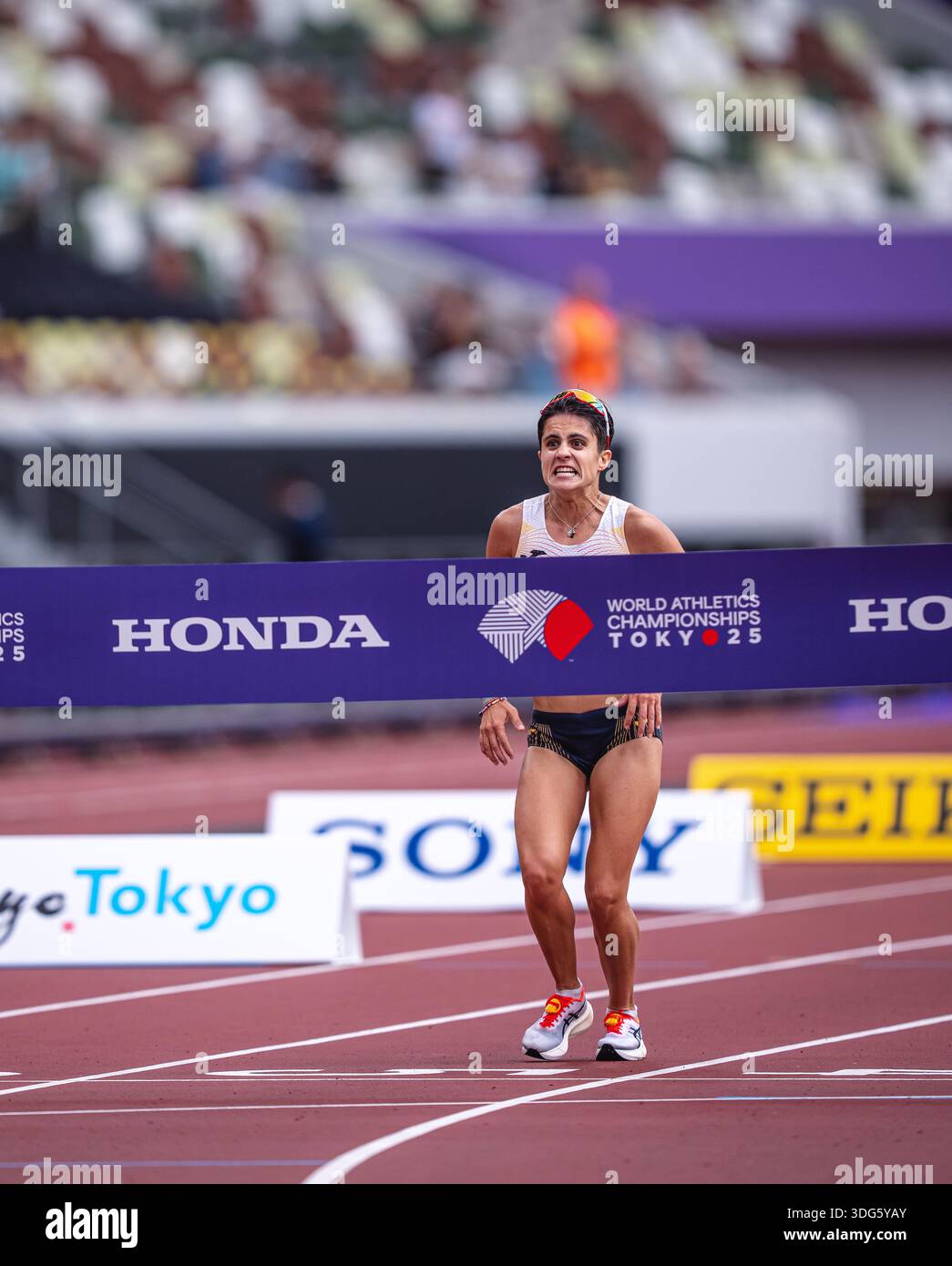Maria Perez celebrating her victory with her country's flag at the 2025 ...