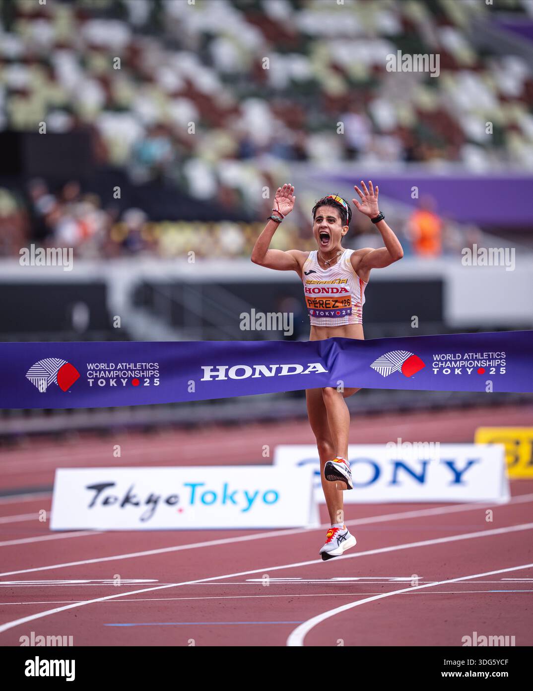 Maria Perez celebrating her victory with her country's flag at the 2025 ...