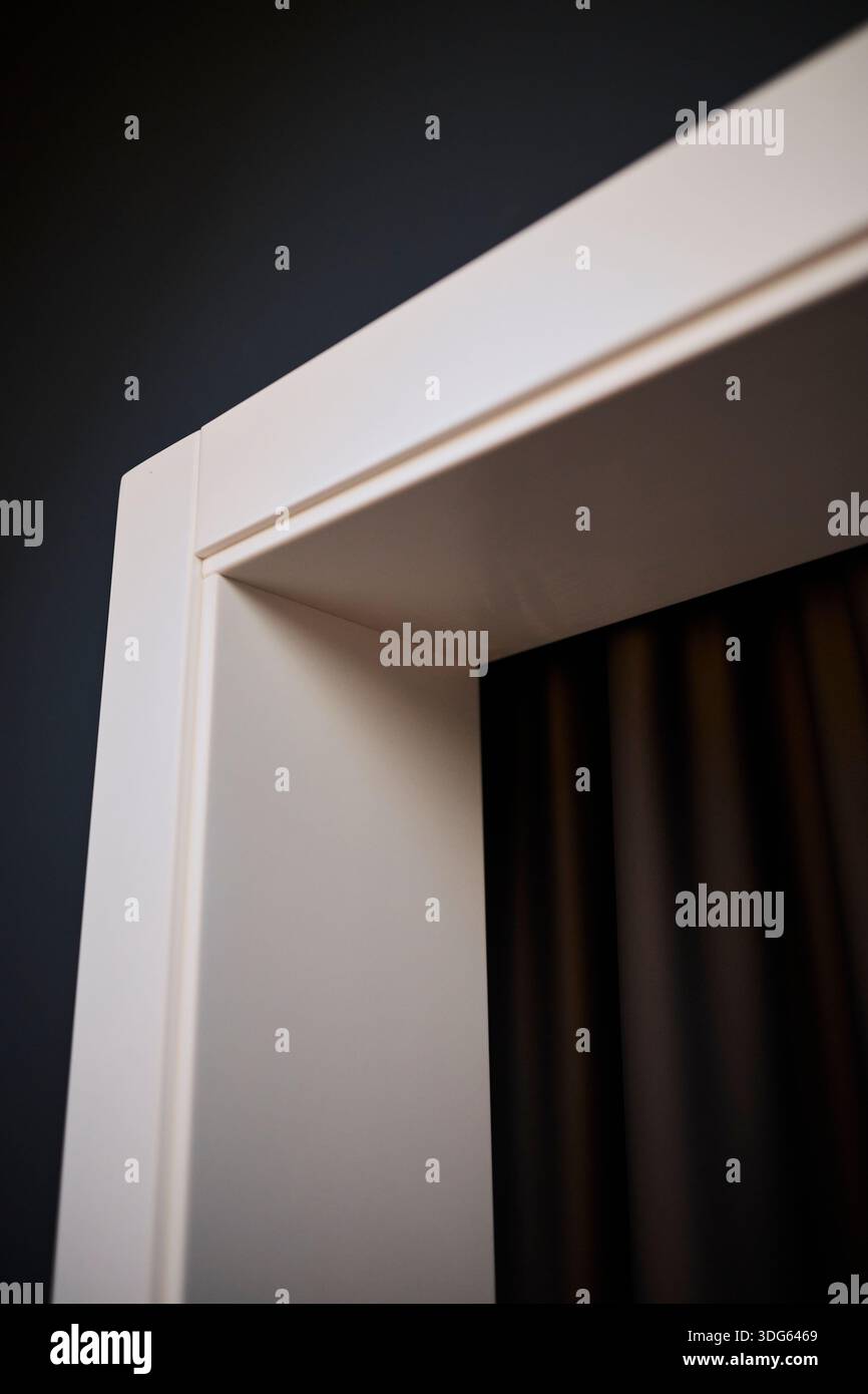 White Wooden Door Frame Against Dark Interior Background Stock Photo ...