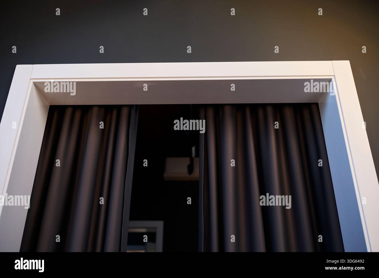 White Wooden Door Frame Against Dark Interior Background Stock Photo ...