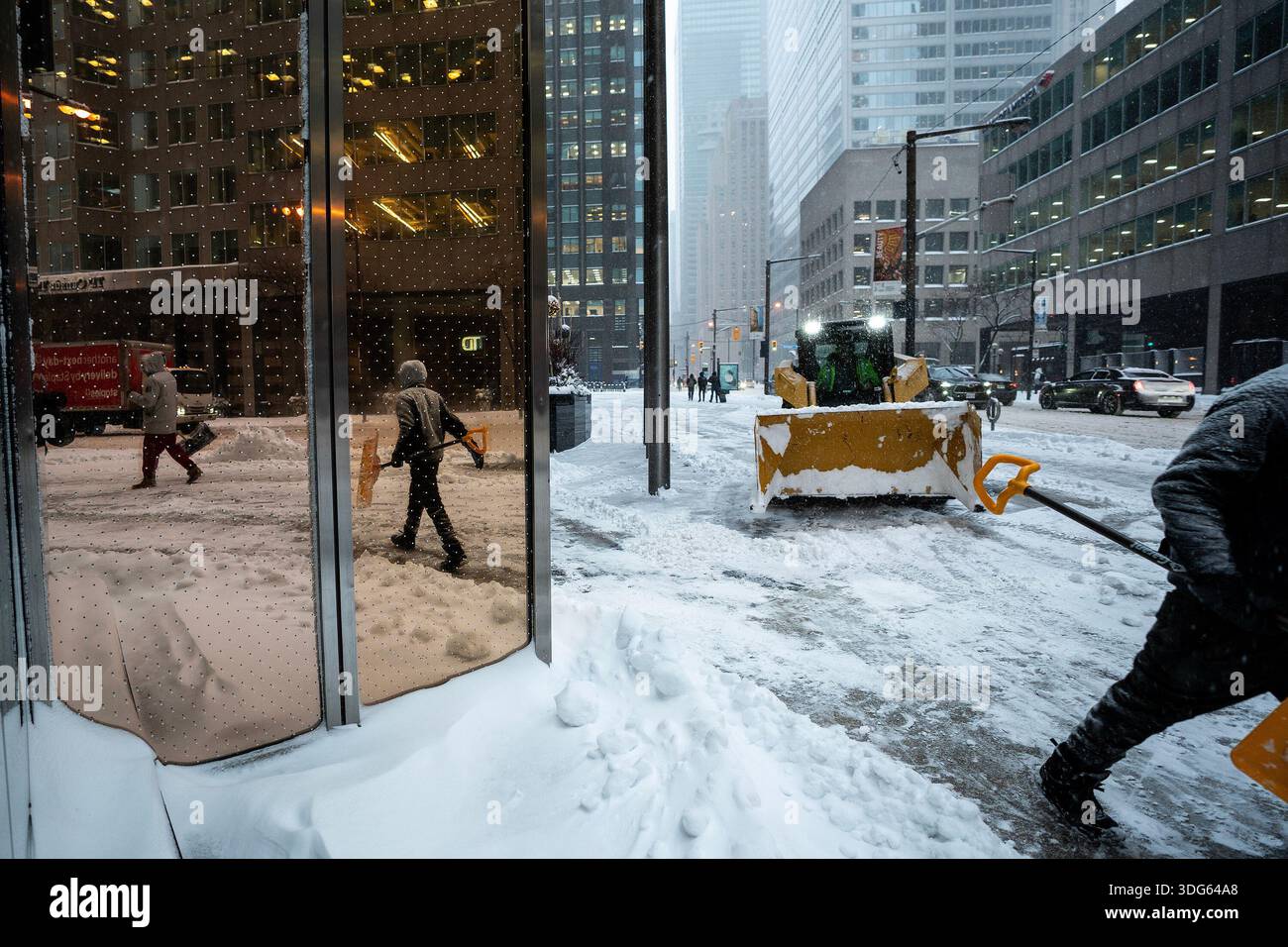 Workers remove snow amid heavy snowfall and accumulation as snow and ...