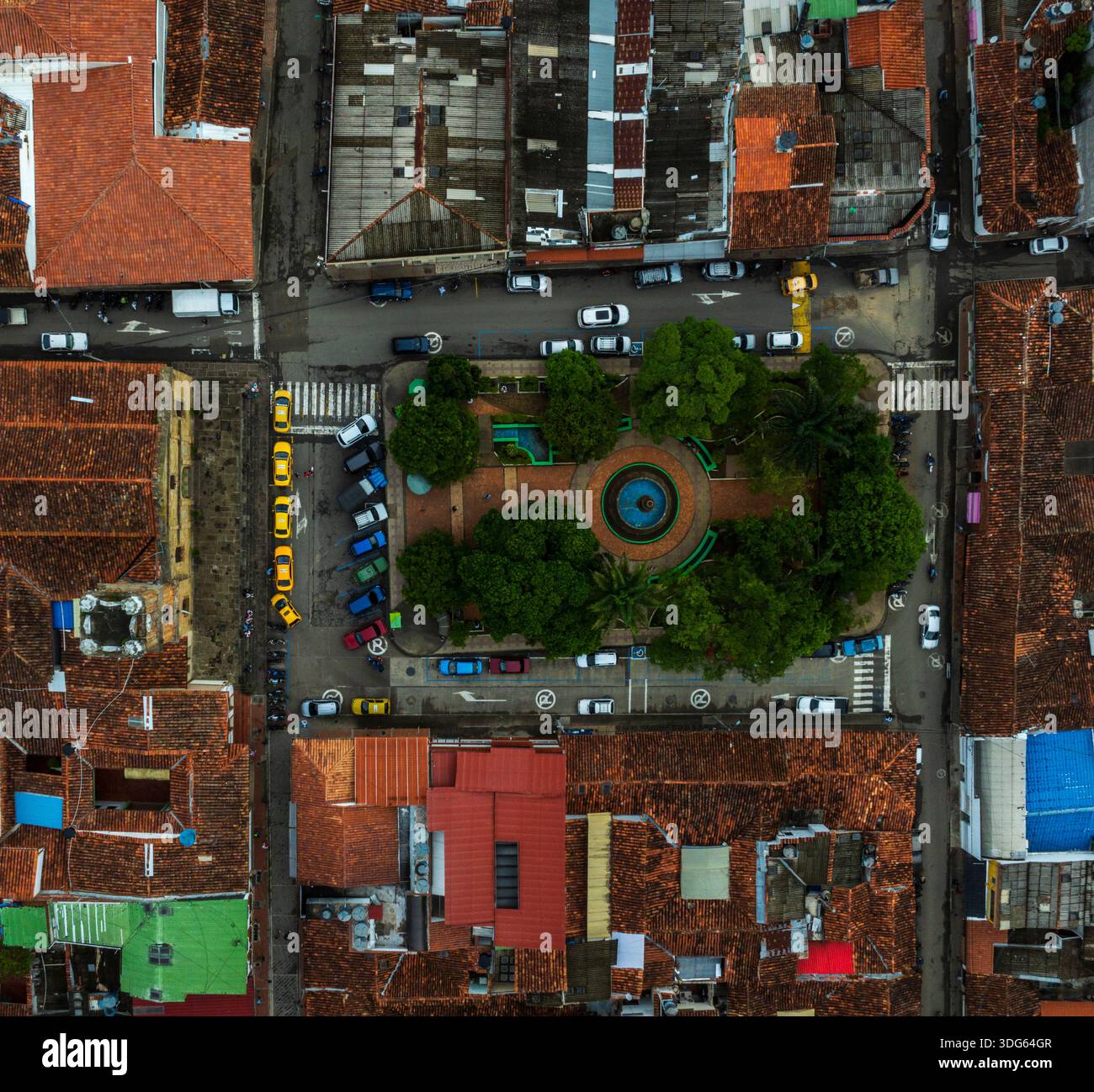 Aerial view of a city block with a central green plaza and surrounding ...