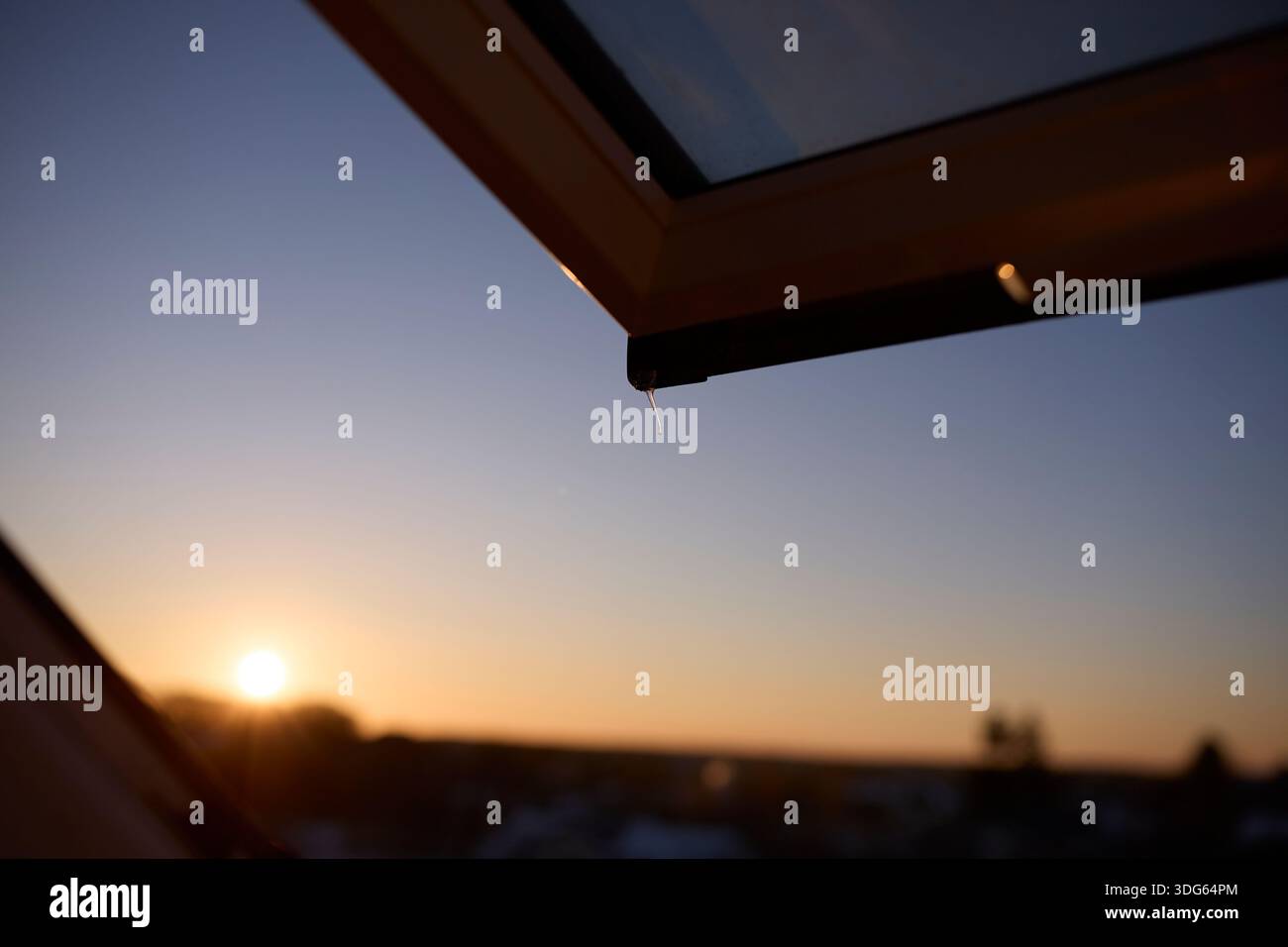 Close-up of a roof window installed in a ceiling, allowing natural ...