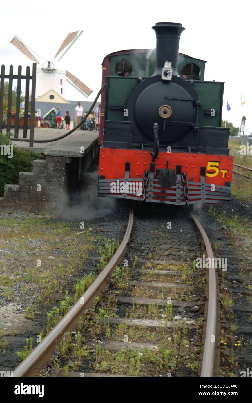 Steam train on narrow gauge Railway, with windmill in distance, Tralee ...