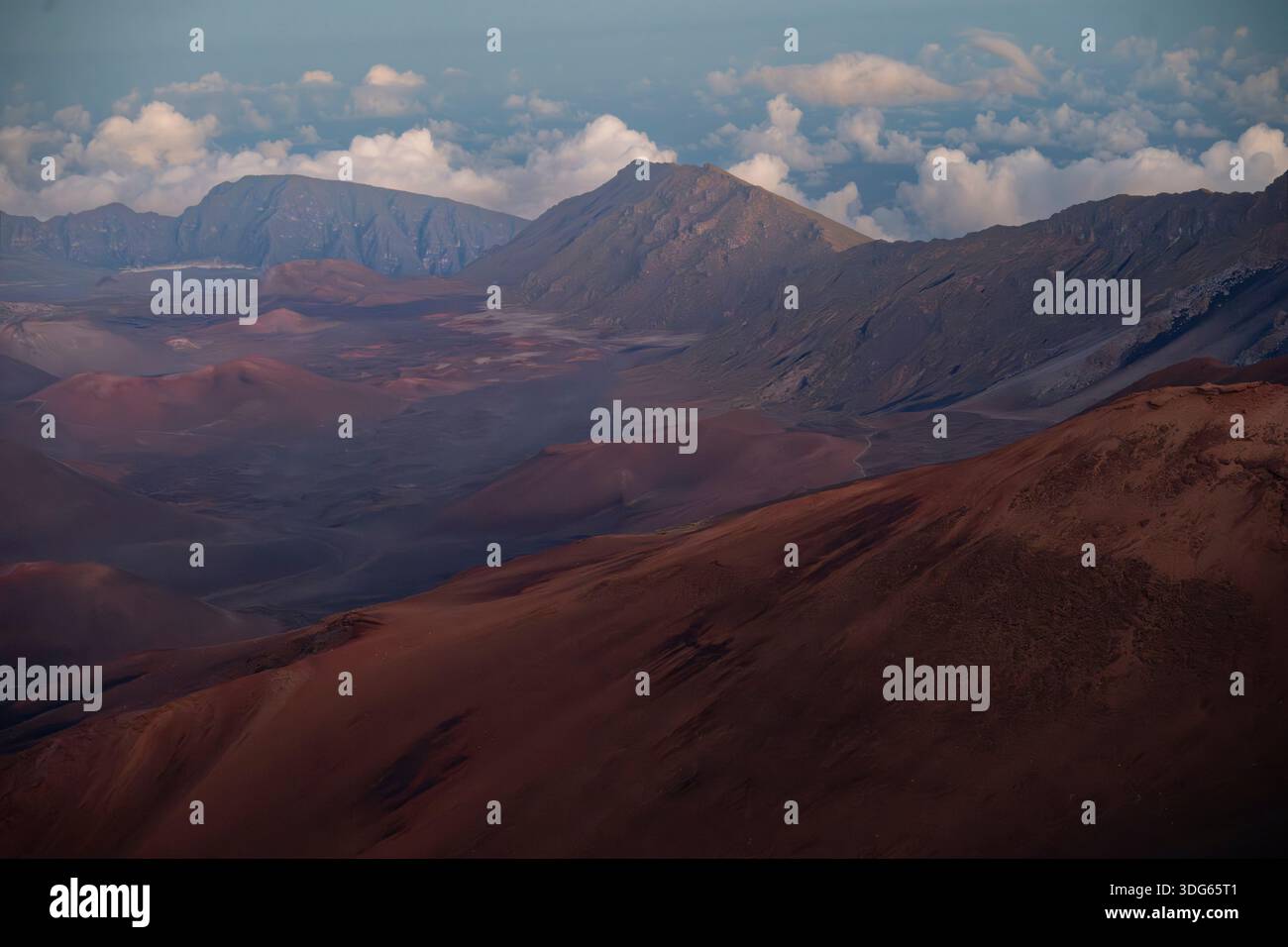 Expansive view of rugged mountains and valleys under a cloudy sky ...