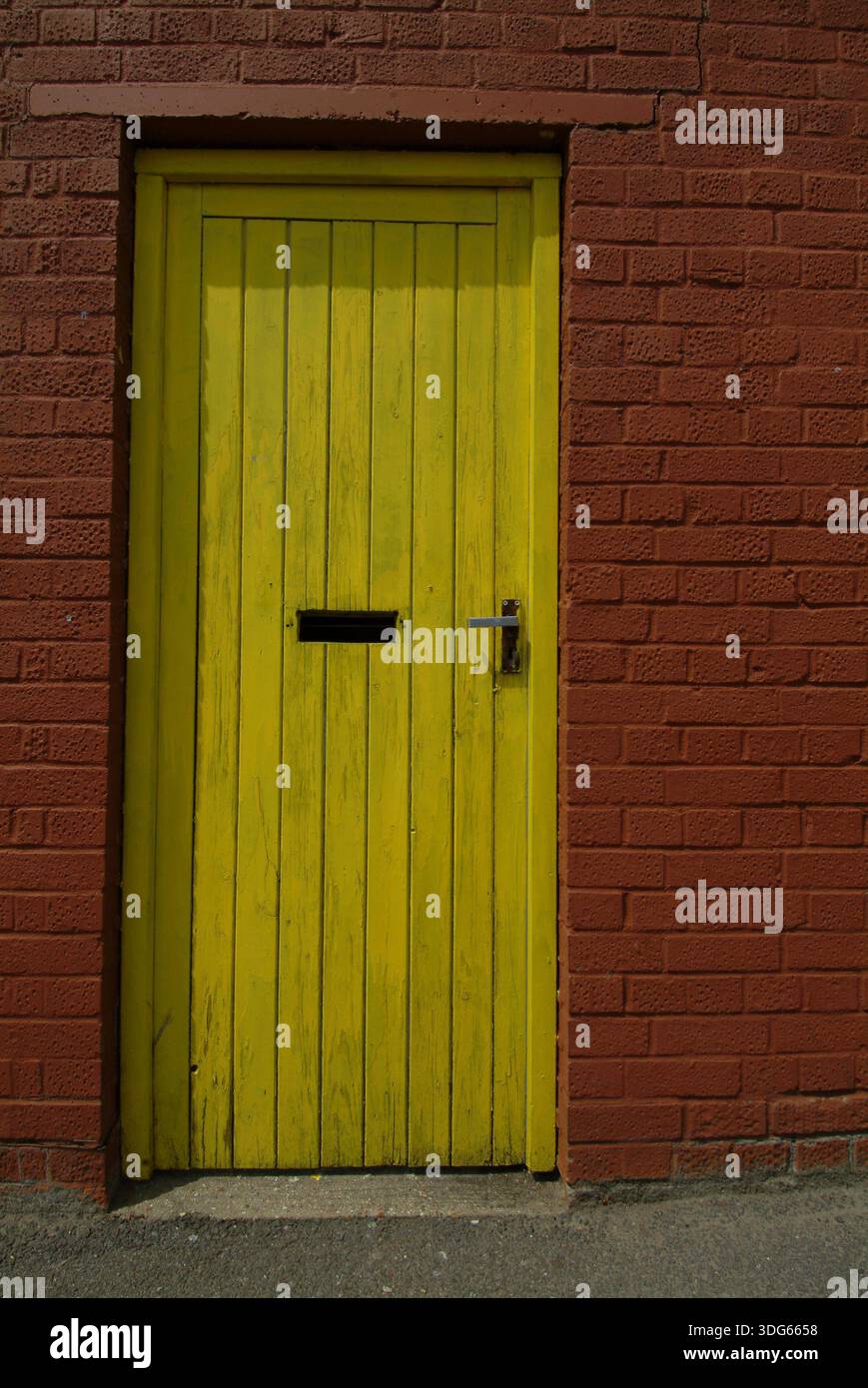 Yellow door on red brick wall. - Hertfordshire, United Kingdom : May ...