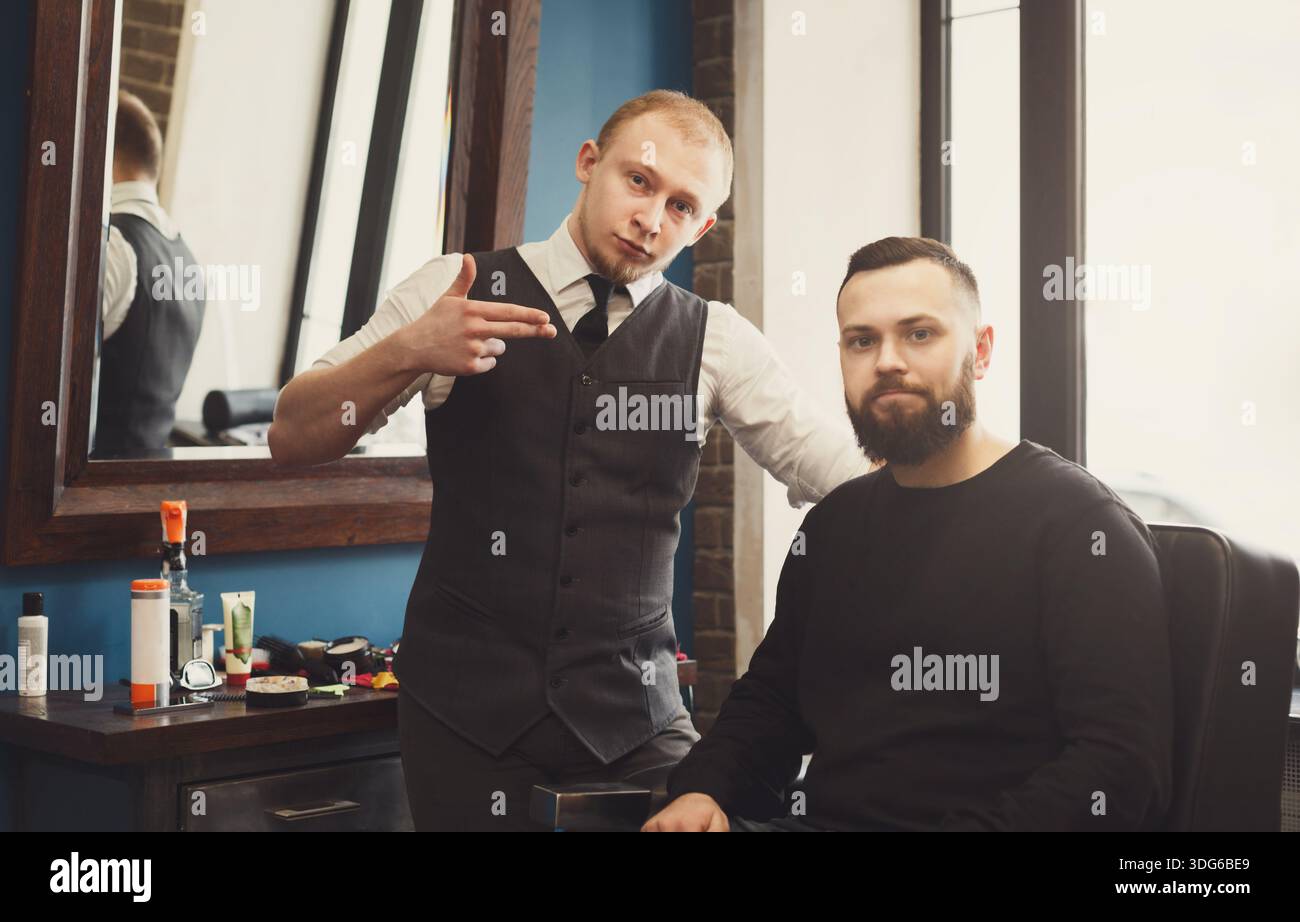 Client and barber shaking hands at barbershop Stock Photo - Alamy