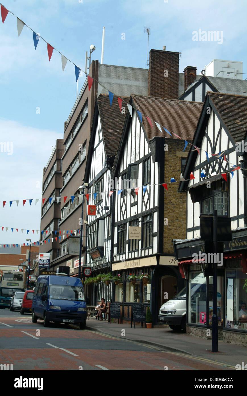 Half-timbered shopfronts lining Pudding Lane in the narrow streets of a ...