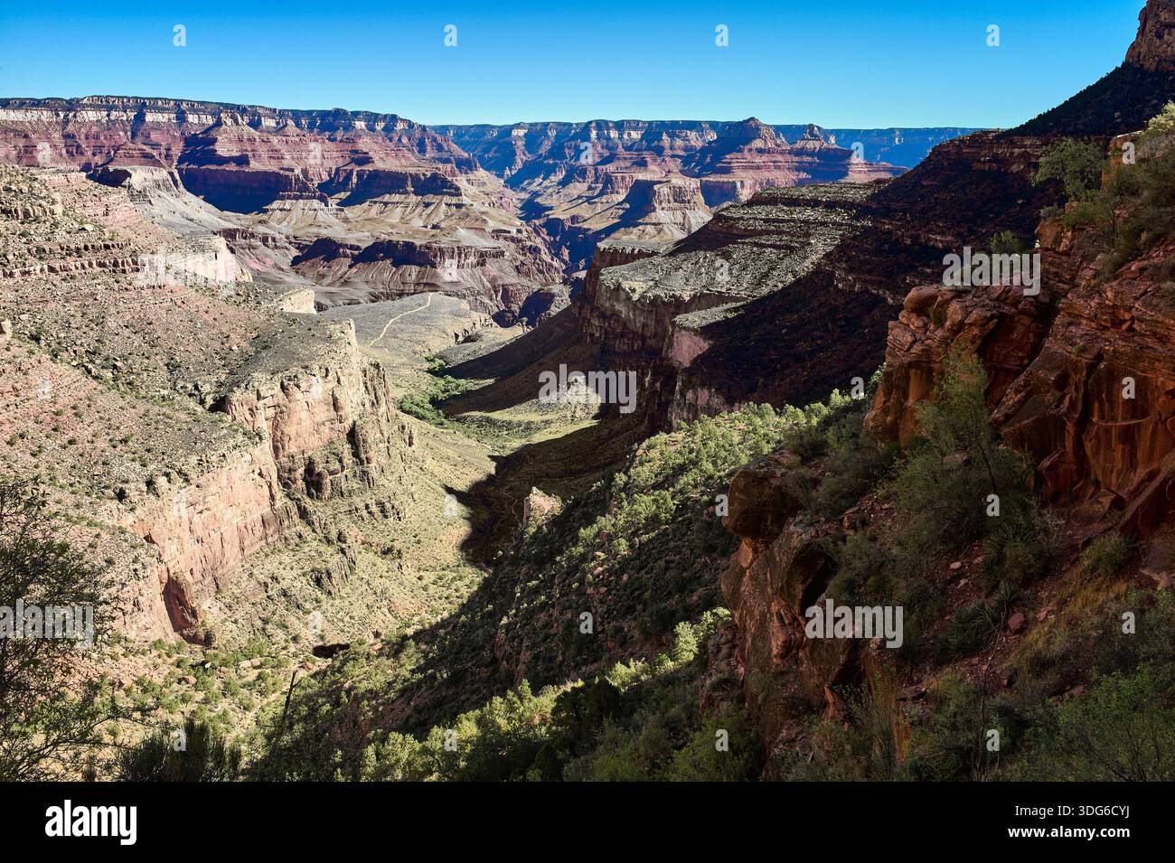 Majestic canyon landscape with layered rock formations under a clear ...
