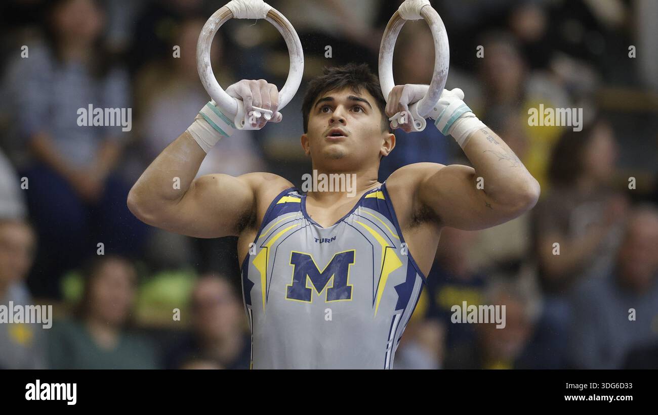 Michigan's Jake Islam competes on the rings during an NCAA gymnastics ...